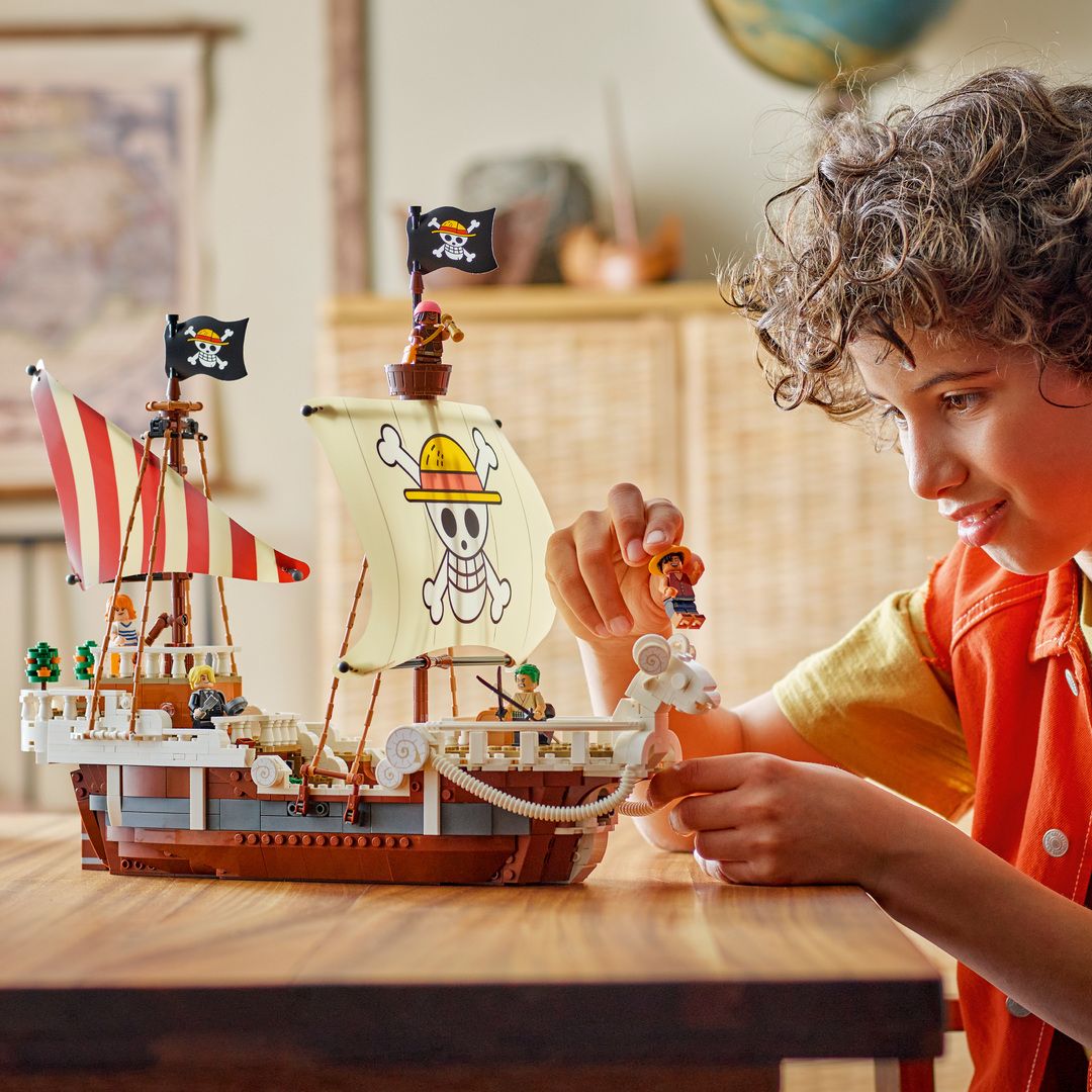 A child building a Lego set of the Going Merry from Netflix’s one piece live action series
